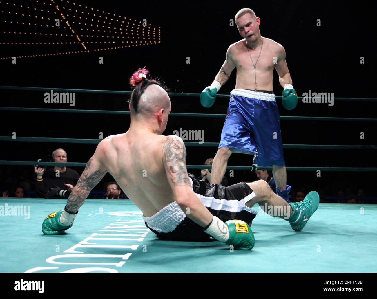 Jose Espinal stands over Joe Rosa after knocking him down during their bout on Saturday, March ...