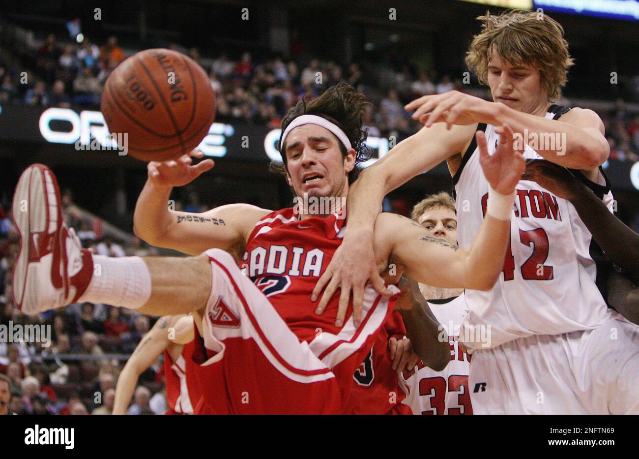 Carleton University Ravens' Aaron Doornekamp, right, knocks over Acadia ...