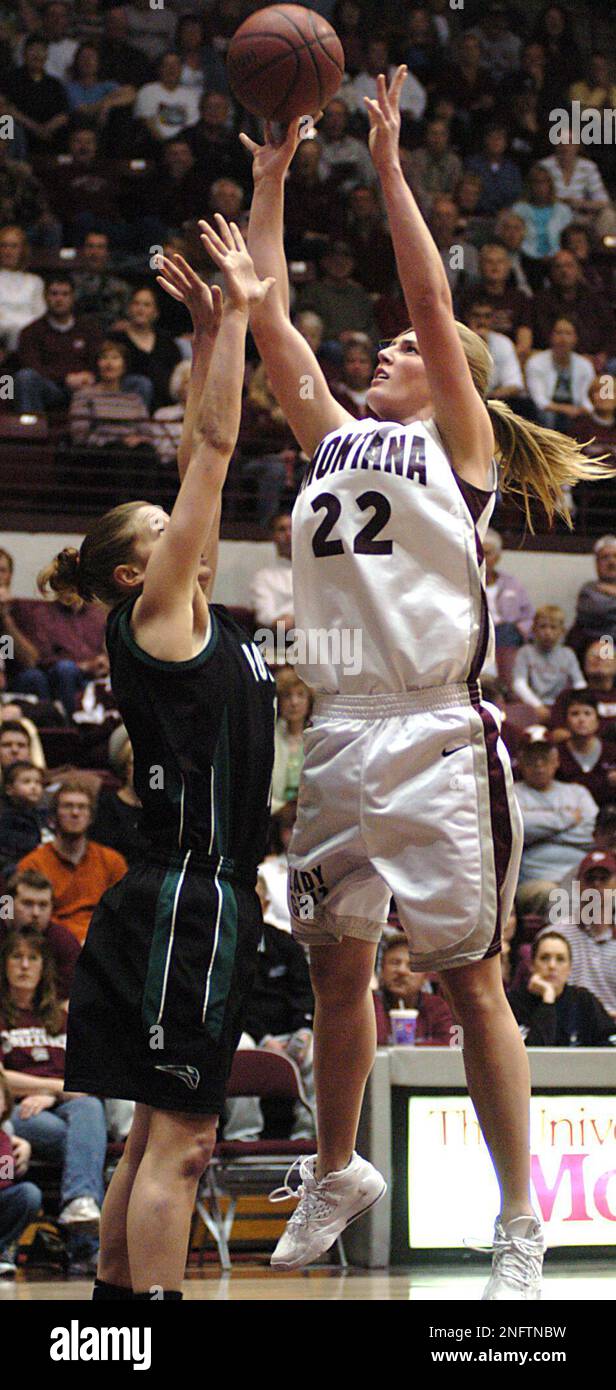 Montana forward Britney Lohman, right shotos a basket over Portland ...