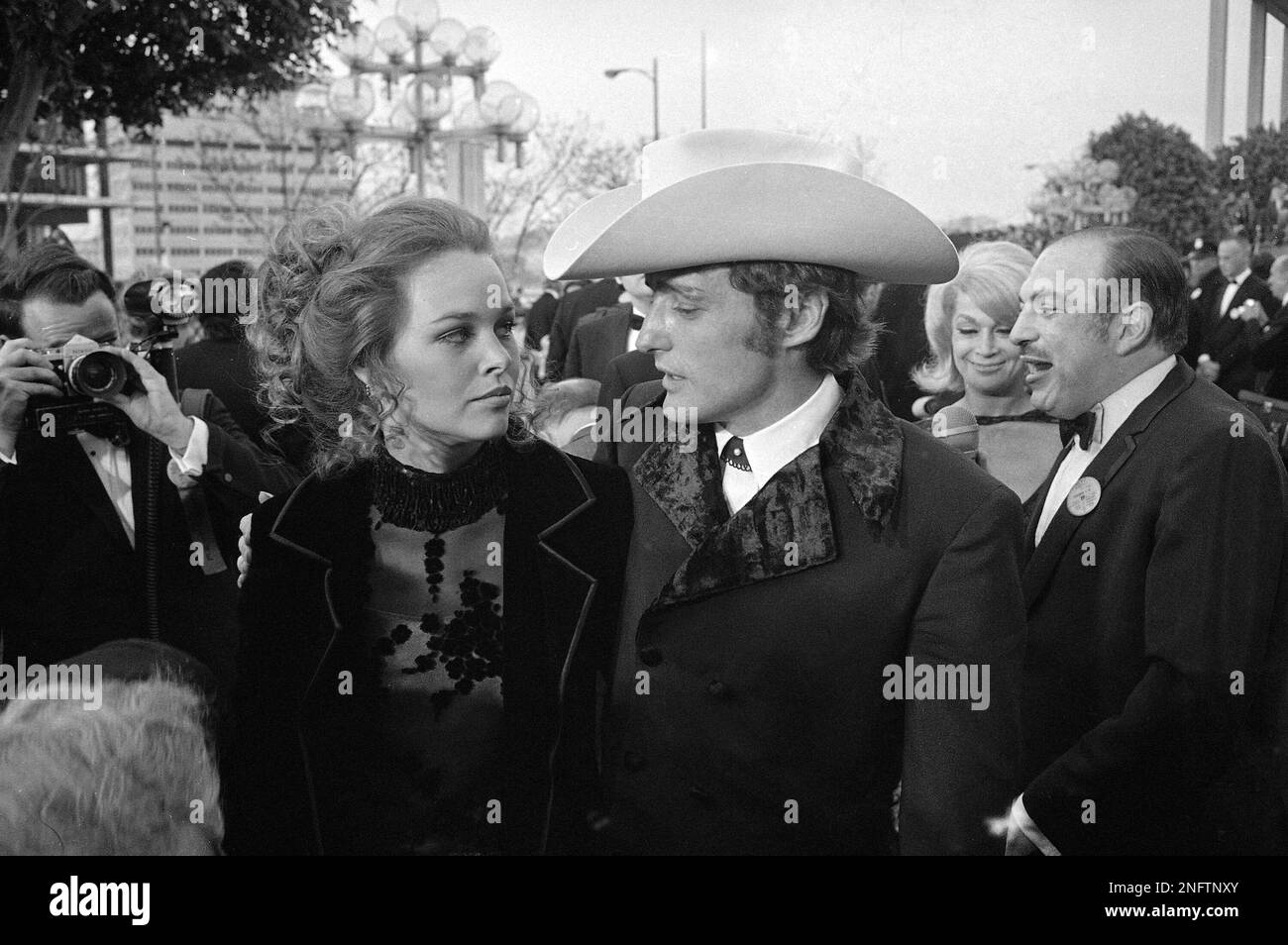 Actor Dennis Hopper and singer Michelle Phillips are shown as they ...