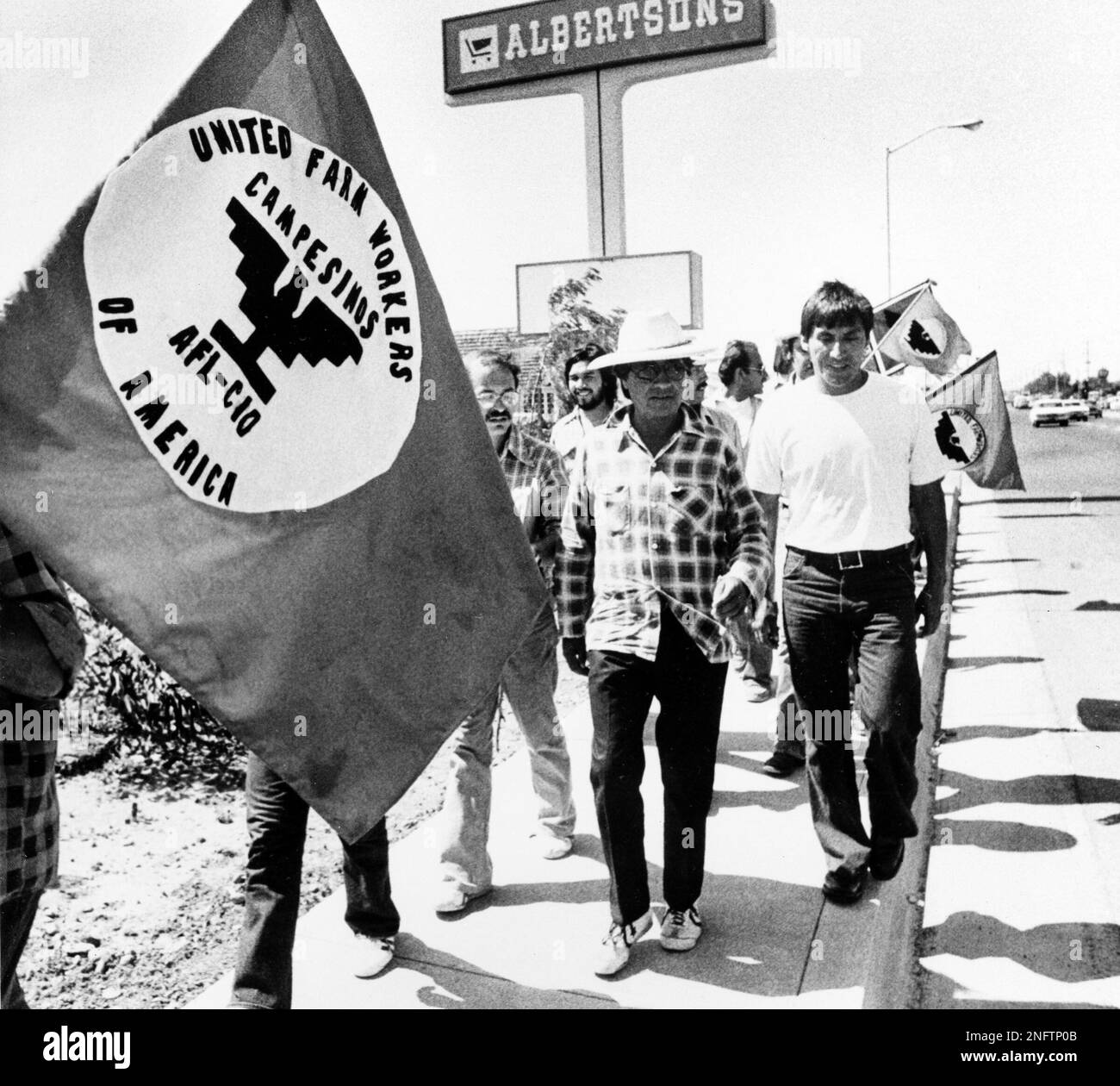 Cesar Chavez, in plaid shirt, marches with members of the United Farm ...