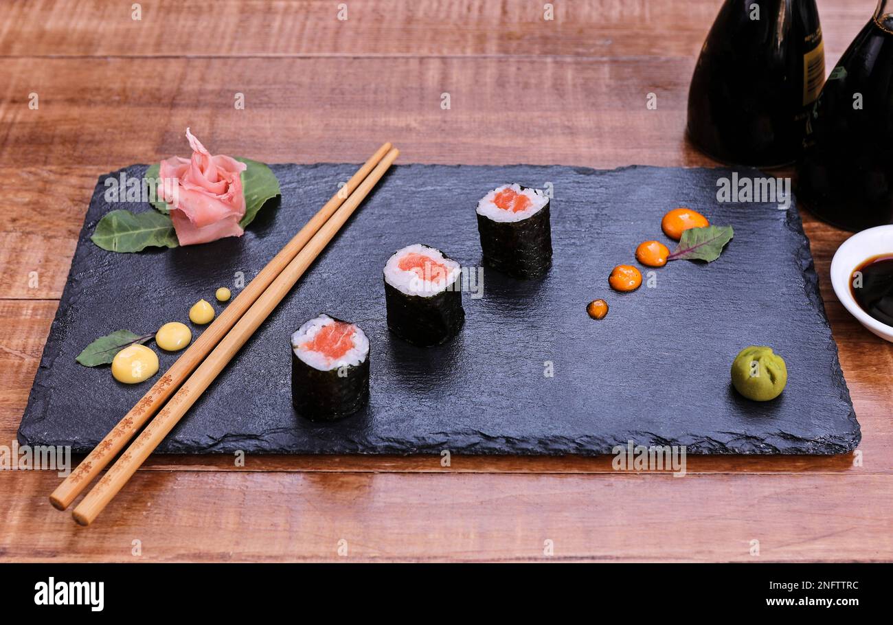 A Chinese sushi set on black kitchen board Stock Photo - Alamy