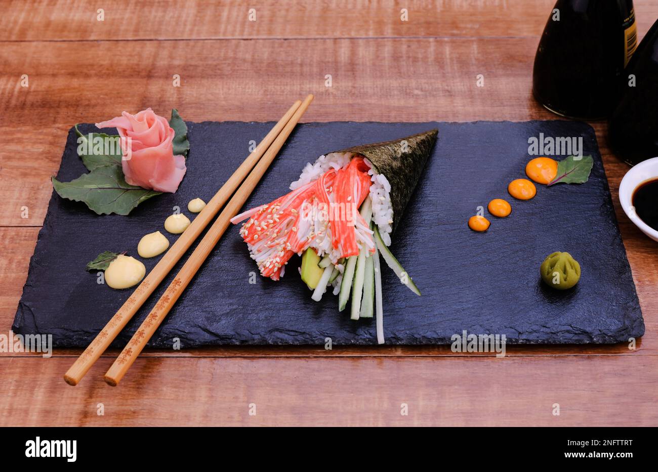 A Chinese sushi set on black kitchen board Stock Photo - Alamy