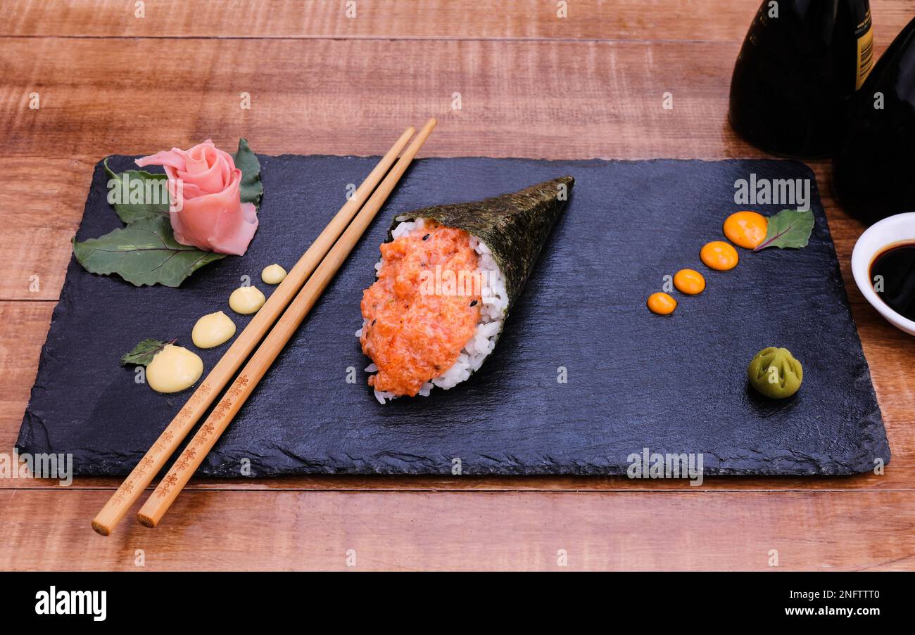 A Chinese sushi set on black kitchen board Stock Photo - Alamy