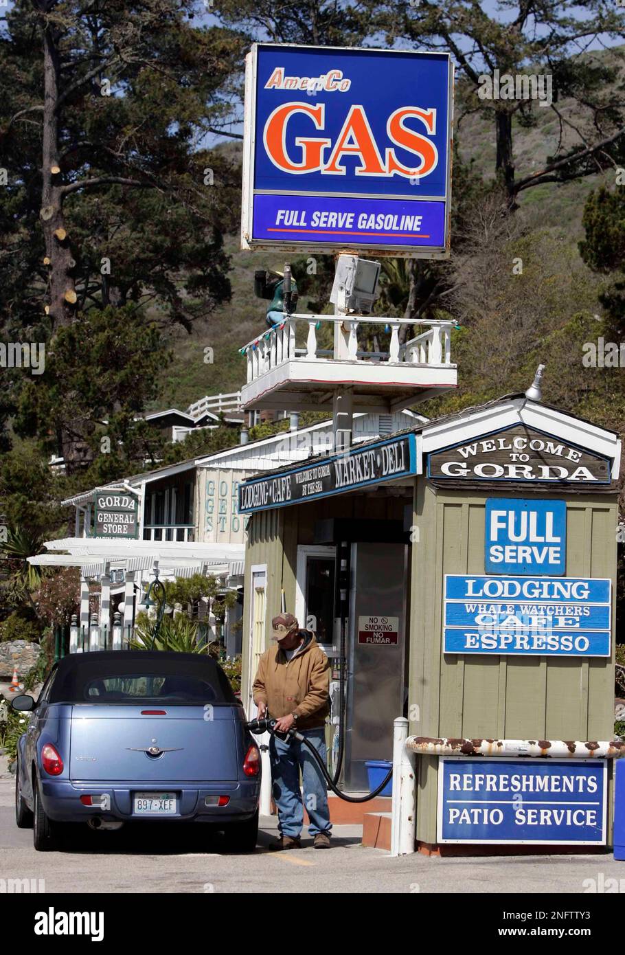 Jim Willman pumps gas at his gas station in Gorda, Calif., Tuesday ...