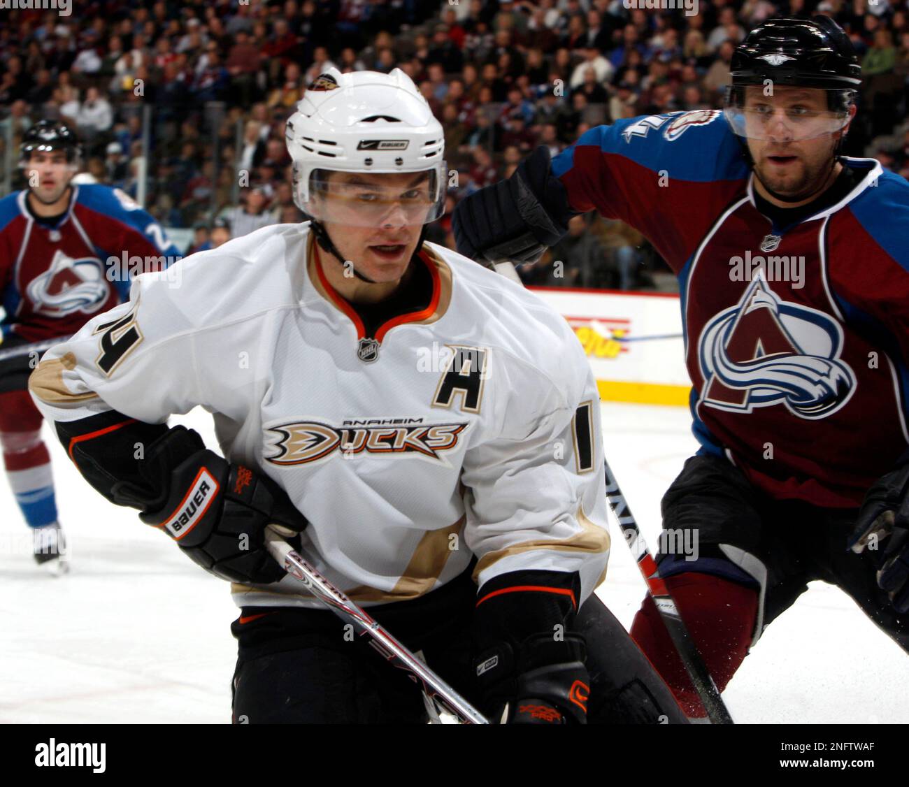 Anaheim Ducks left winger Chris Kunitz, front, heads to the corner to ...