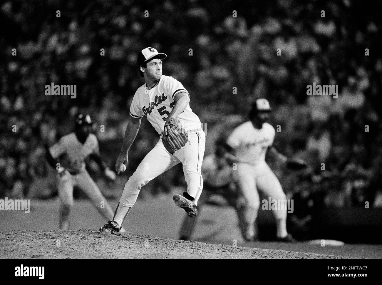 Baltimore Orioles pitcher Mike Boddicker shows his form on his way to a ...