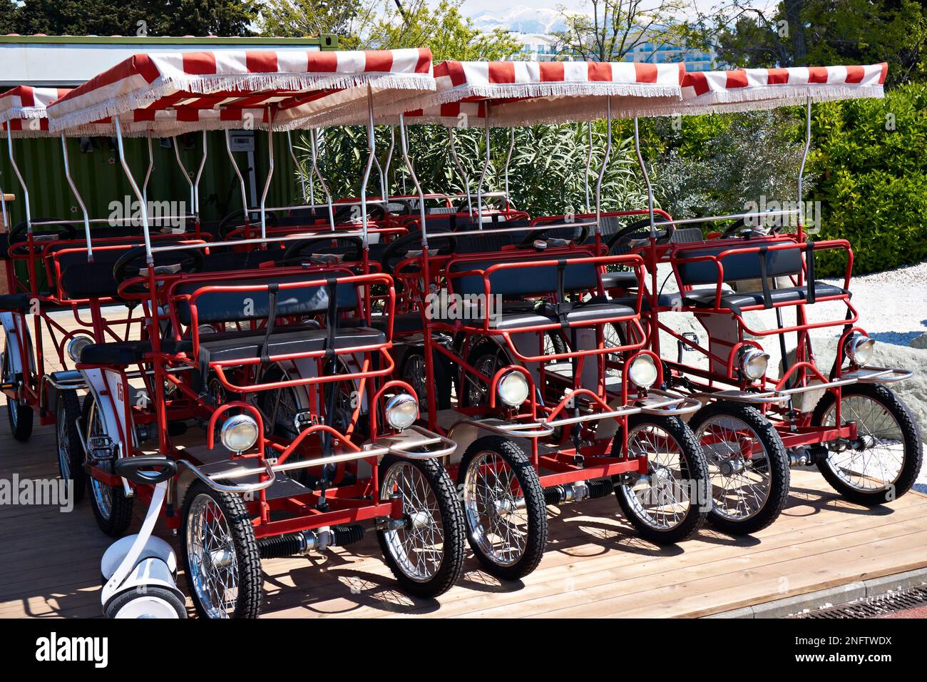 Four wheel red rental bikes Stock Photo - Alamy