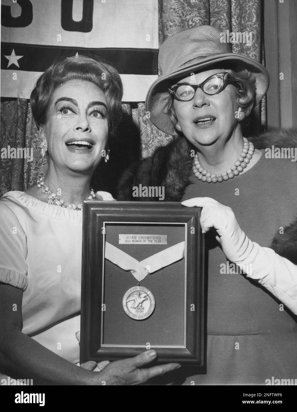 Actress Joan Crawford, left, poses with Mary G. Roebling, chairwoman of ...