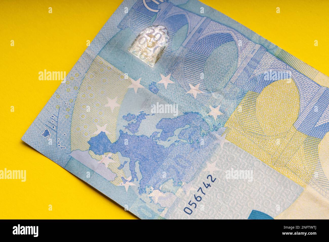 20 euro banknote close up, yellow background for business finance ...