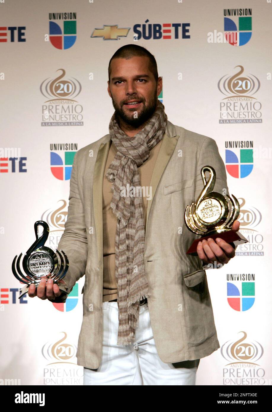 Puerto Rican singer Ricky Martin poses for photographers backstage at ...