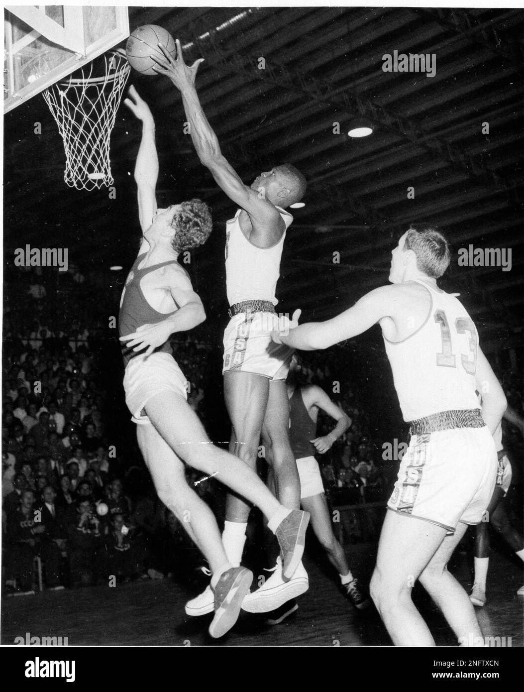 U.S. basketball star Bill Russell (6) easily out jumps Algirdas ...