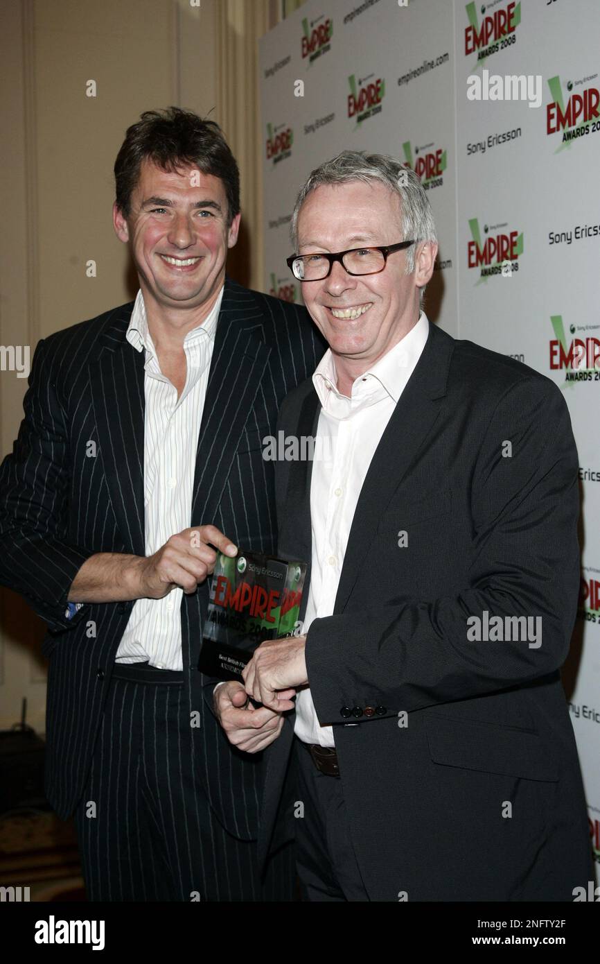 Producers Paul Webster, right, and Tim Bevan pose with their Empire ...