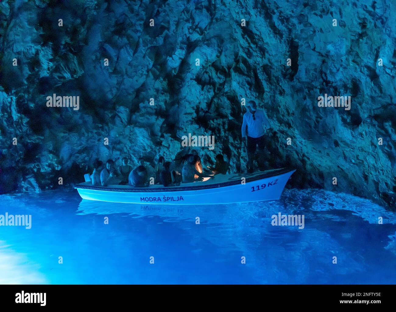 BISEVO ISLAND, CROATIA, EUROPE - Tourists in boat explore Blue Cave ...