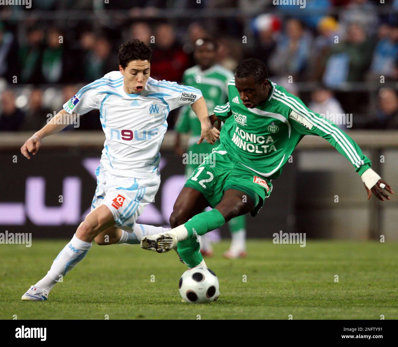 Marseille's midfielder Samir Nasri, left, challenges for the ball with ...