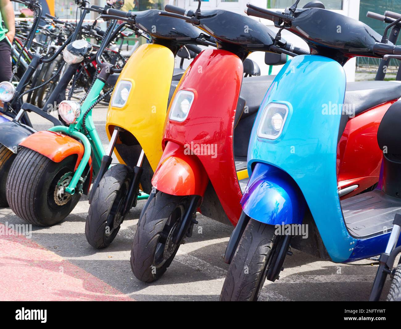 Electric scooters for rent in the parking lot in sunny weather Stock ...