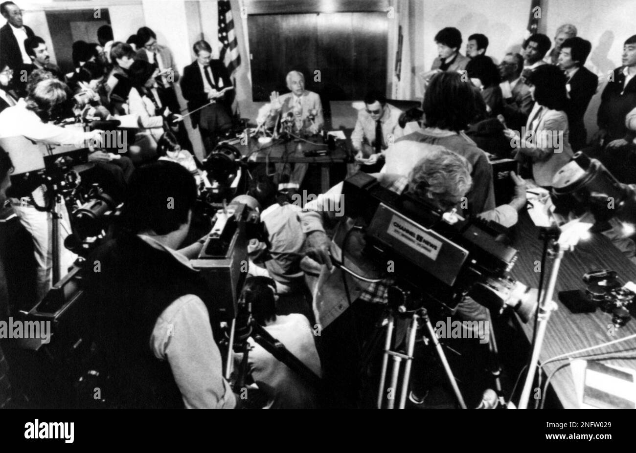 Los Angeles Police Lt. Dan Cooke, seated, is literally surrounded by ...
