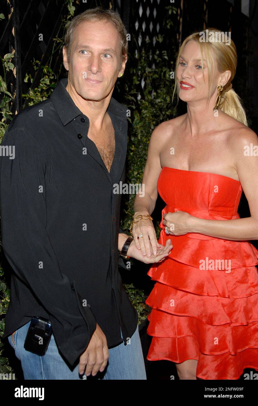 Actress Nicollette Sheridan, right, and singer Michael Bolton pose on ...