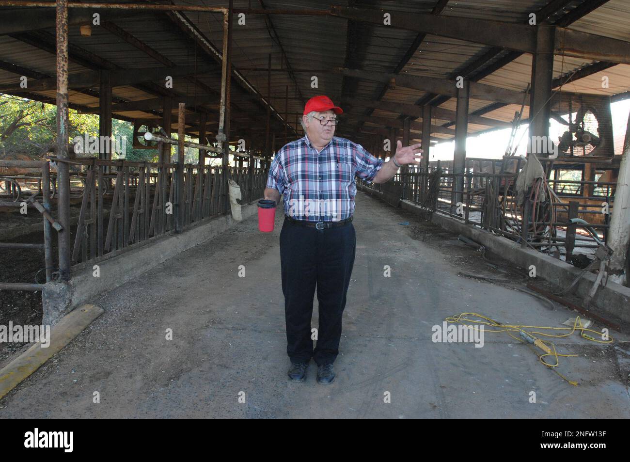 Former dairy farmer Bill Boyce stands in an open air barn owned by ...