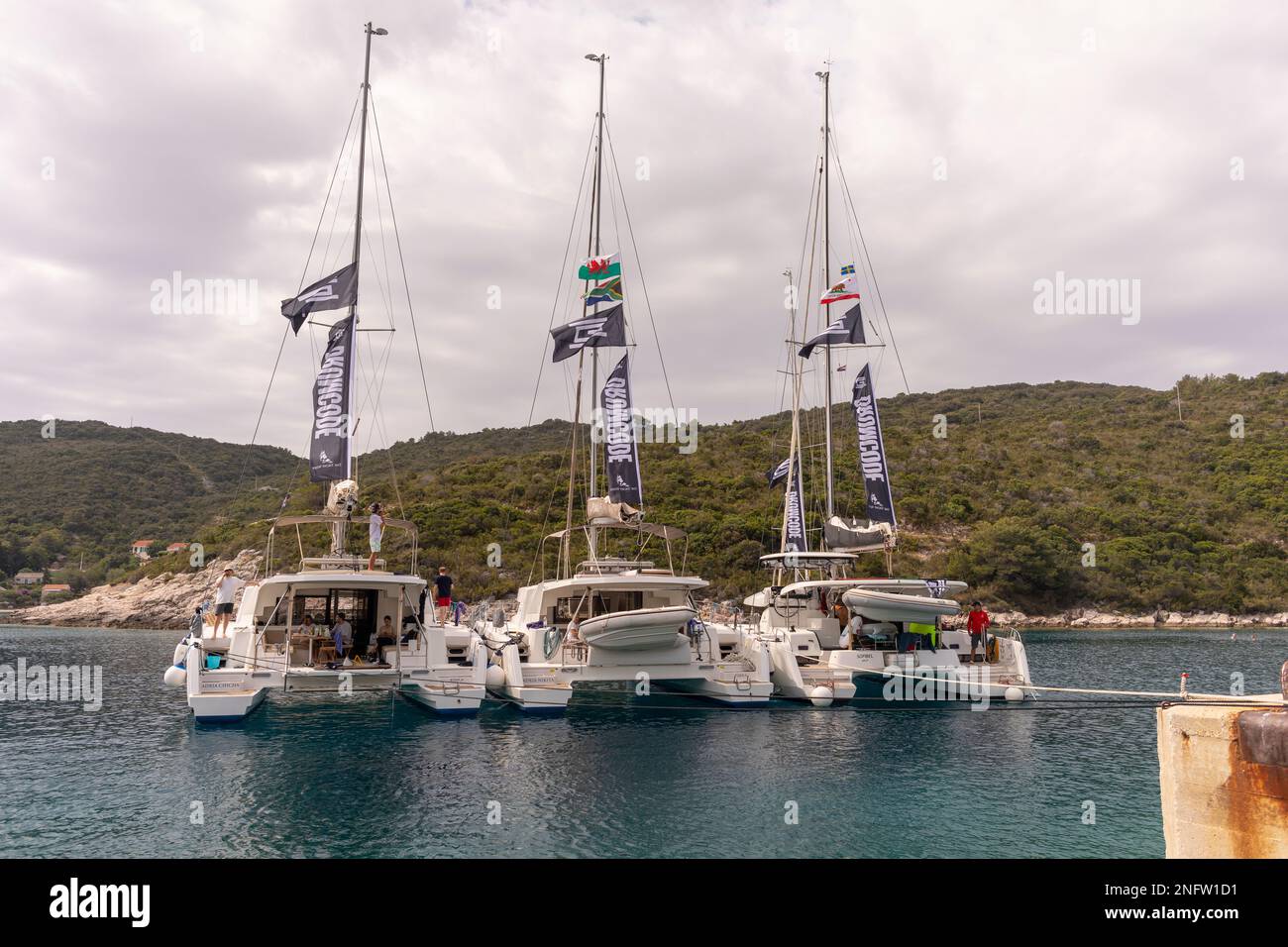 ISLAND OF VIS, CROATIA, EUROPE - Three catamaran sailboats in Parja Bay ...