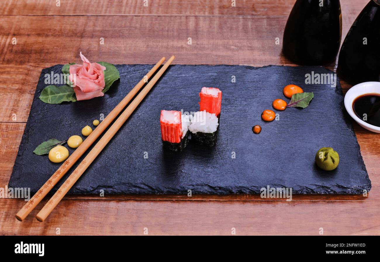 A Chinese sushi set on black kitchen board Stock Photo - Alamy