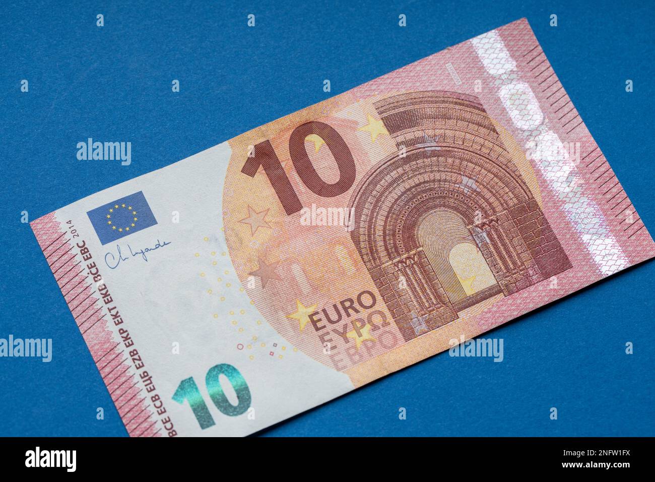 10 euro banknote close up, blue background for business finance topics ...