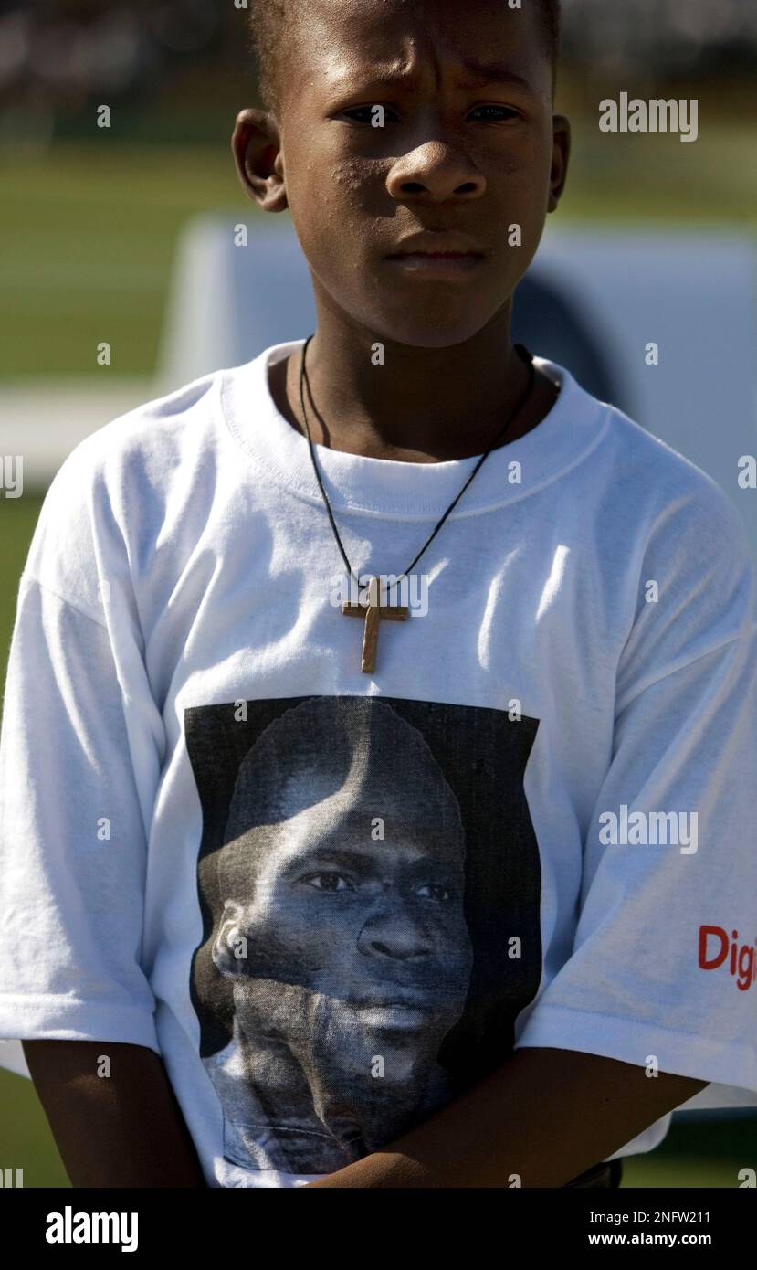 A boy with a shirt showing Haitian soccer legend Emmanuel Sanon attends ...