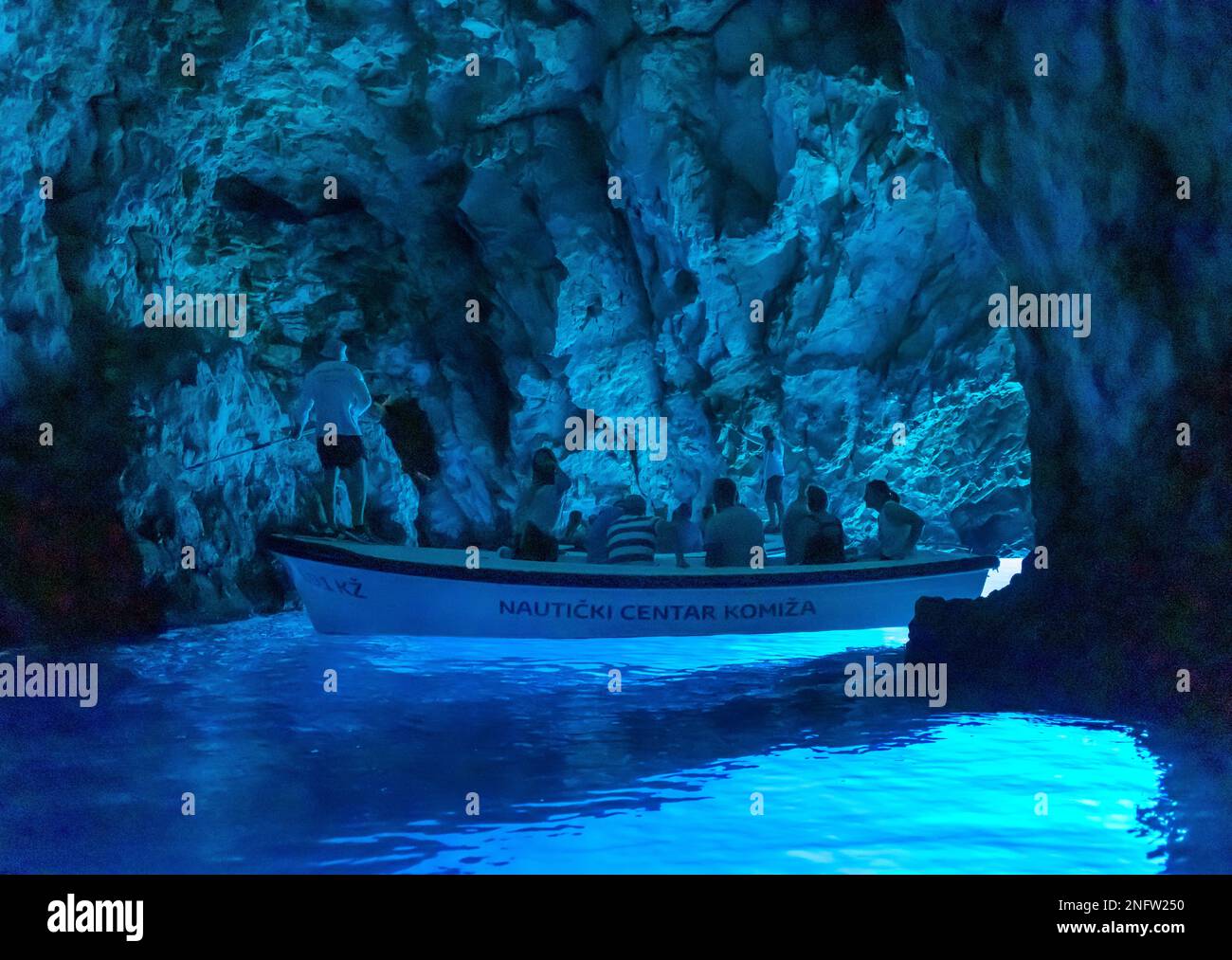 BISEVO ISLAND, CROATIA, EUROPE - Tourists in boat explore Blue Cave ...