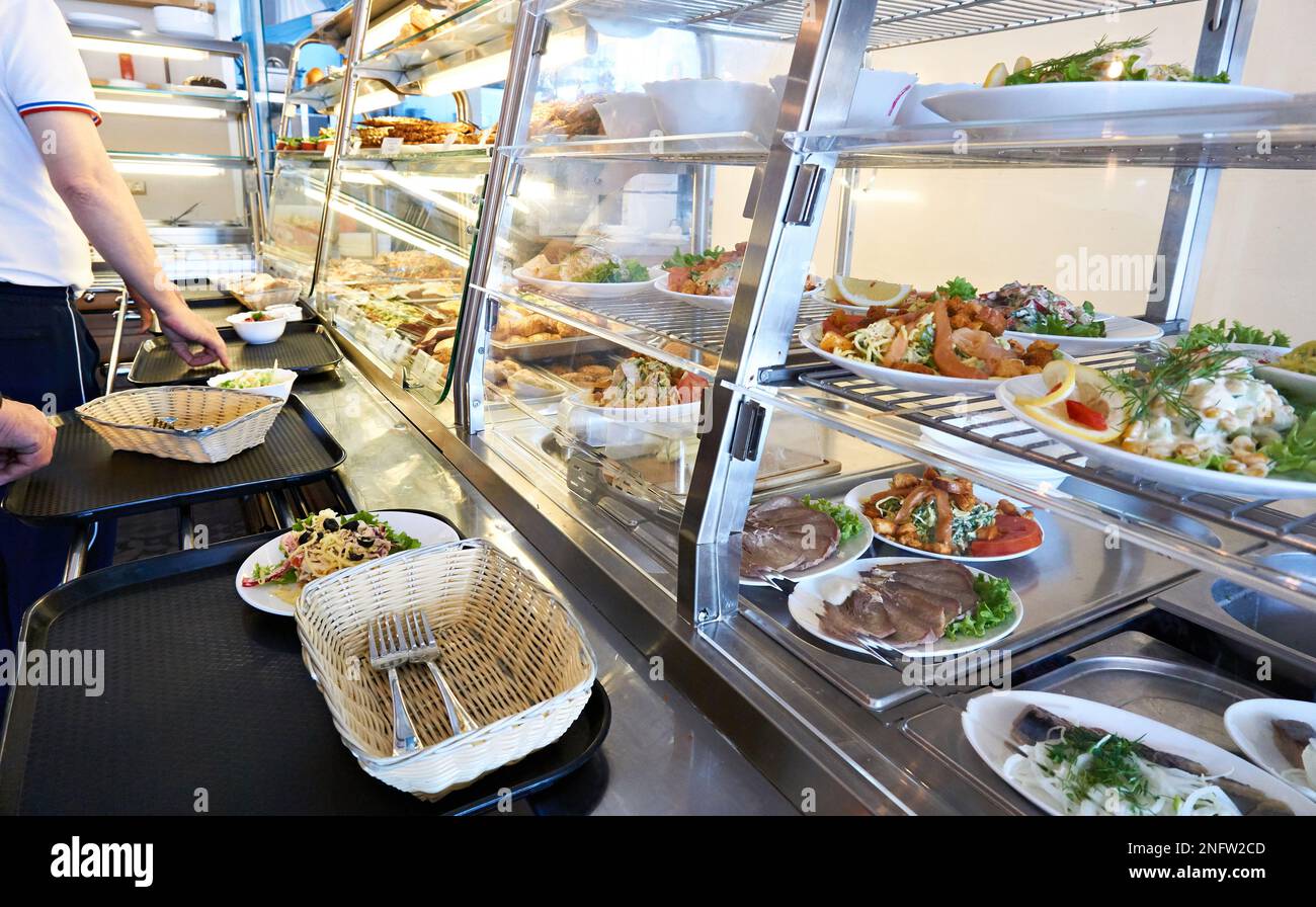 Public dining counter with food Stock Photo - Alamy