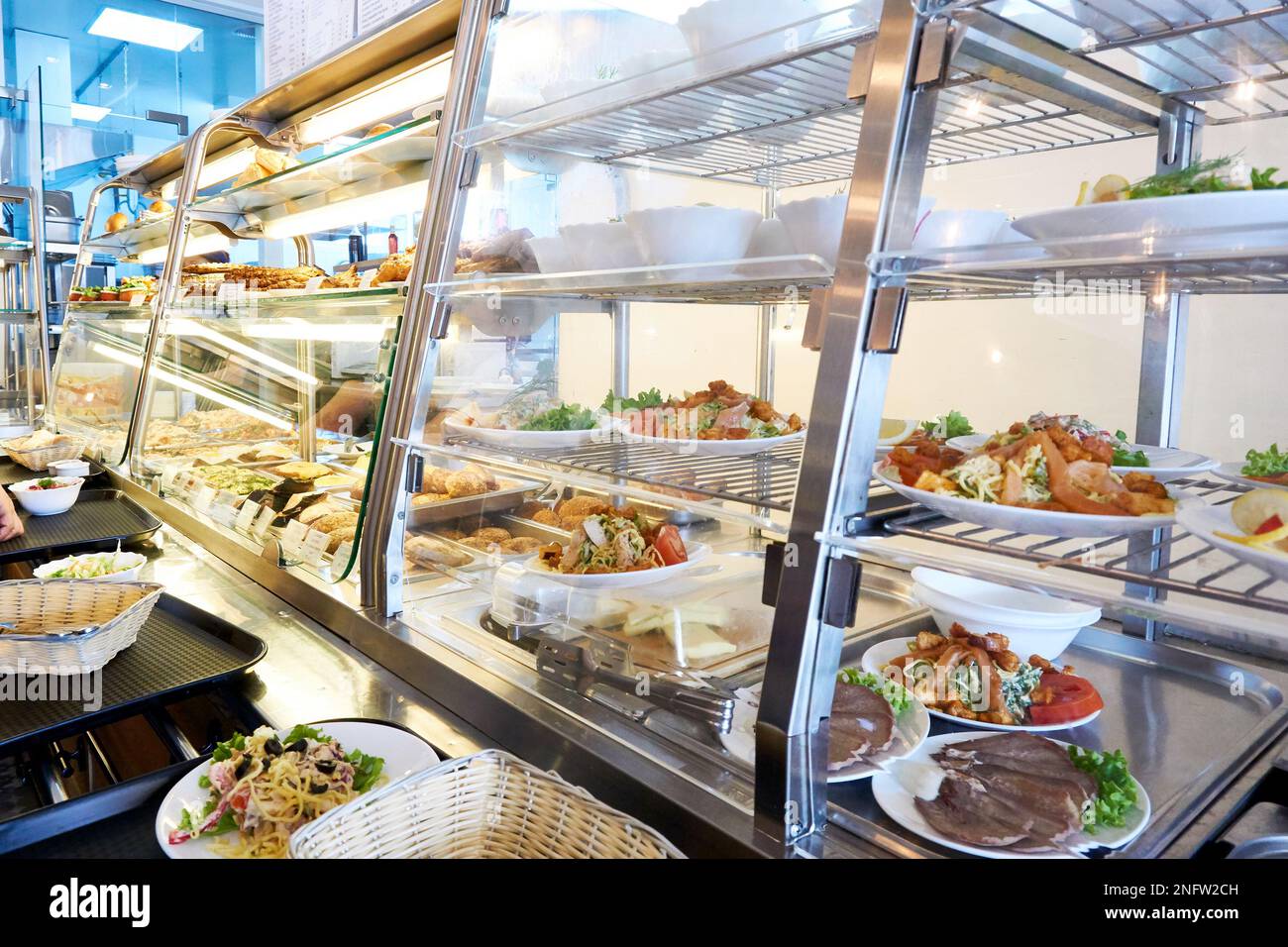 Public dining counter with food Stock Photo - Alamy