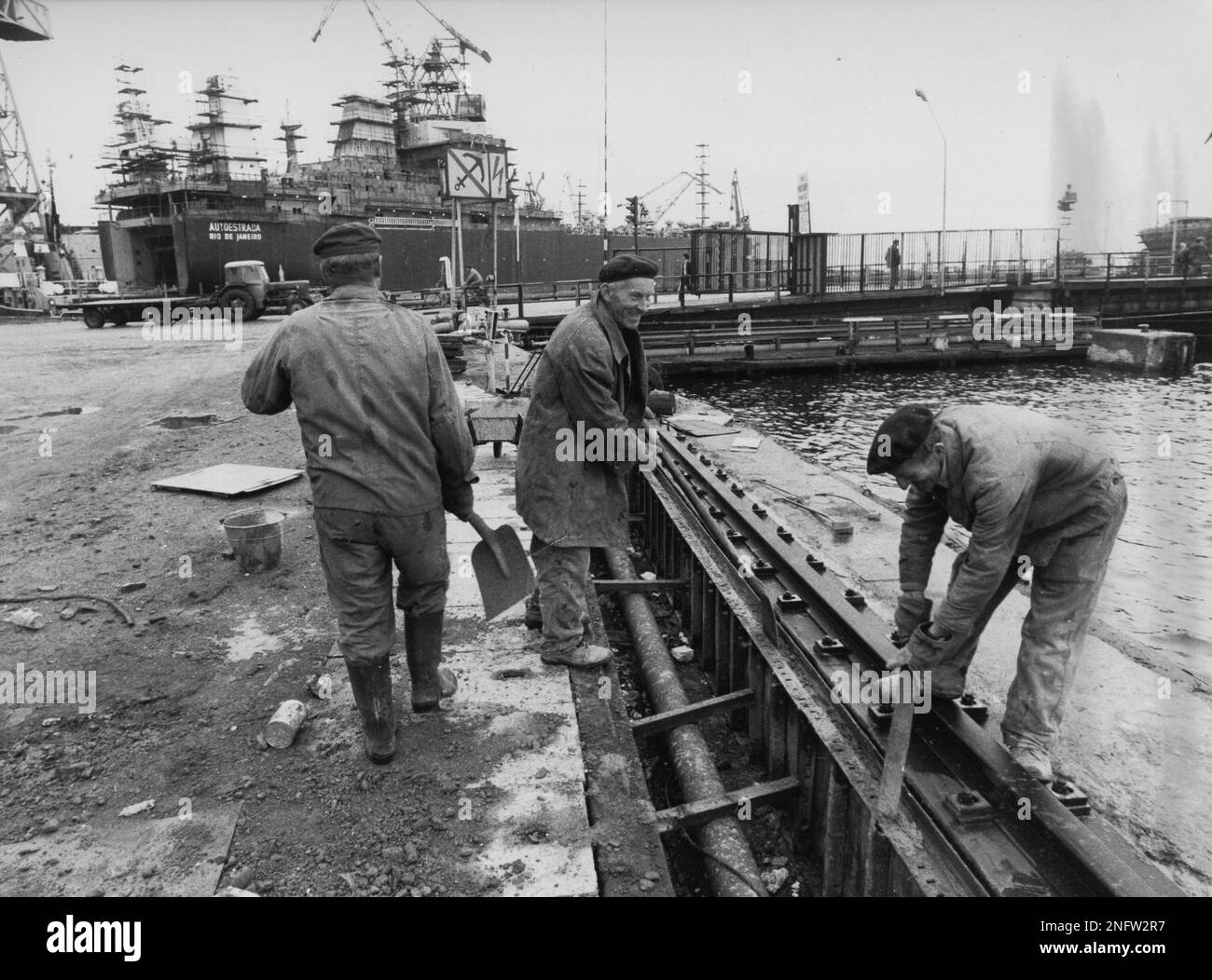 Unidentified maintenance worker are seen back at work at the Lenin ...