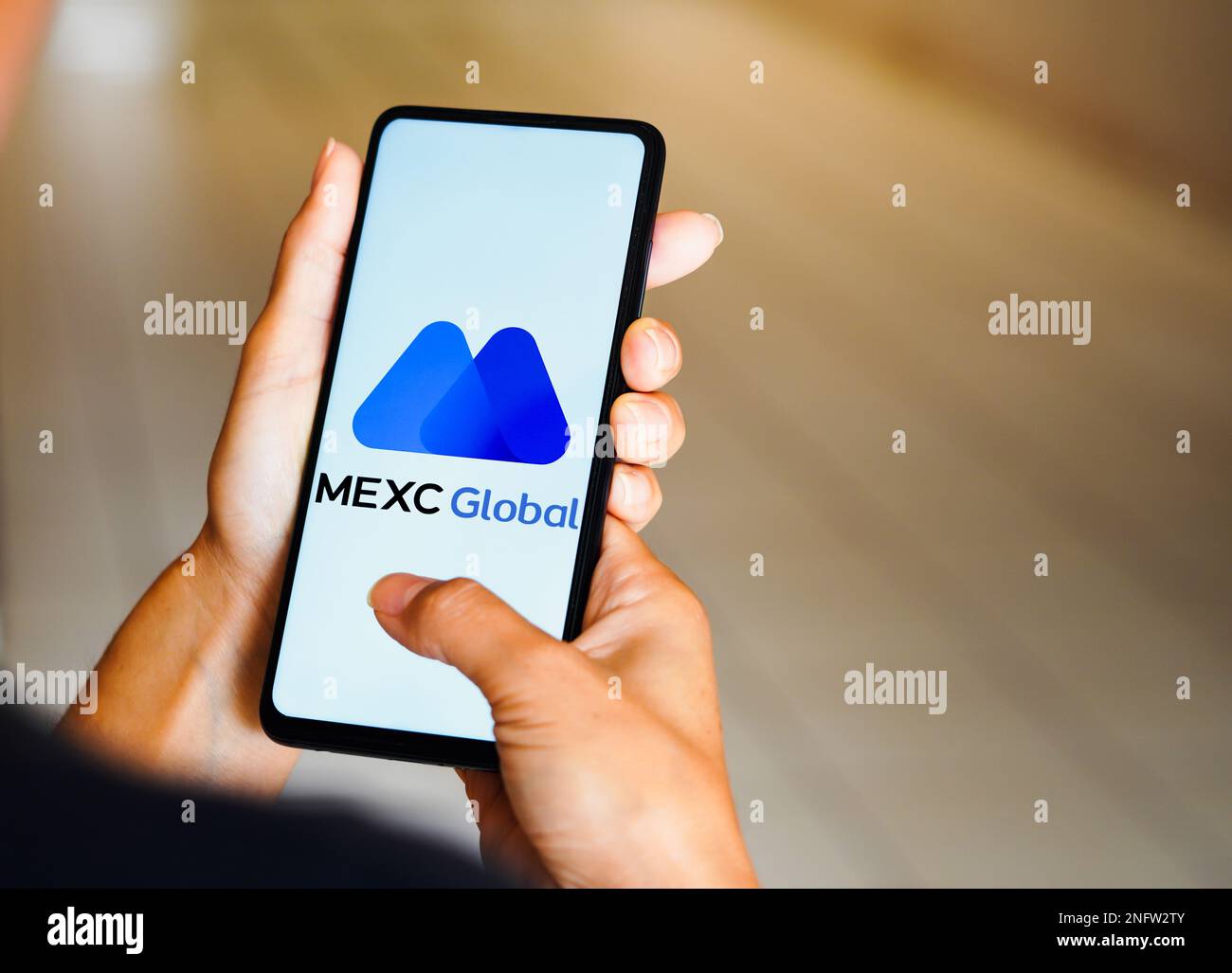 In this photo illustration, the MEXC Global logo is seen displayed on a ...