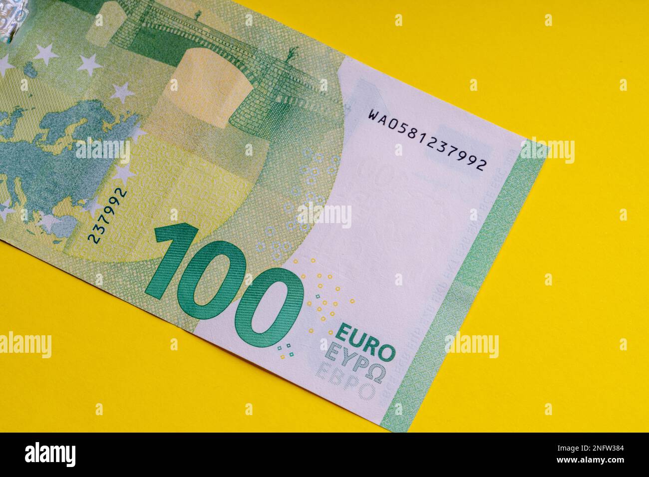 100 euro banknote close up, yellow background for business finance ...