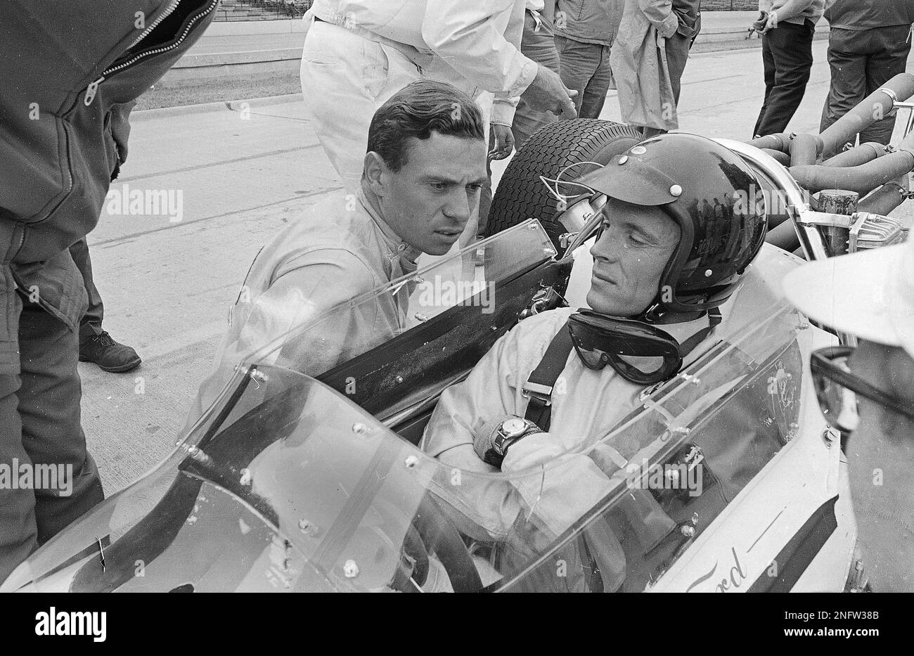 Team Lotus drivers Jim Clark of Duns, Scotland, and Dan Gurney of Costa ...