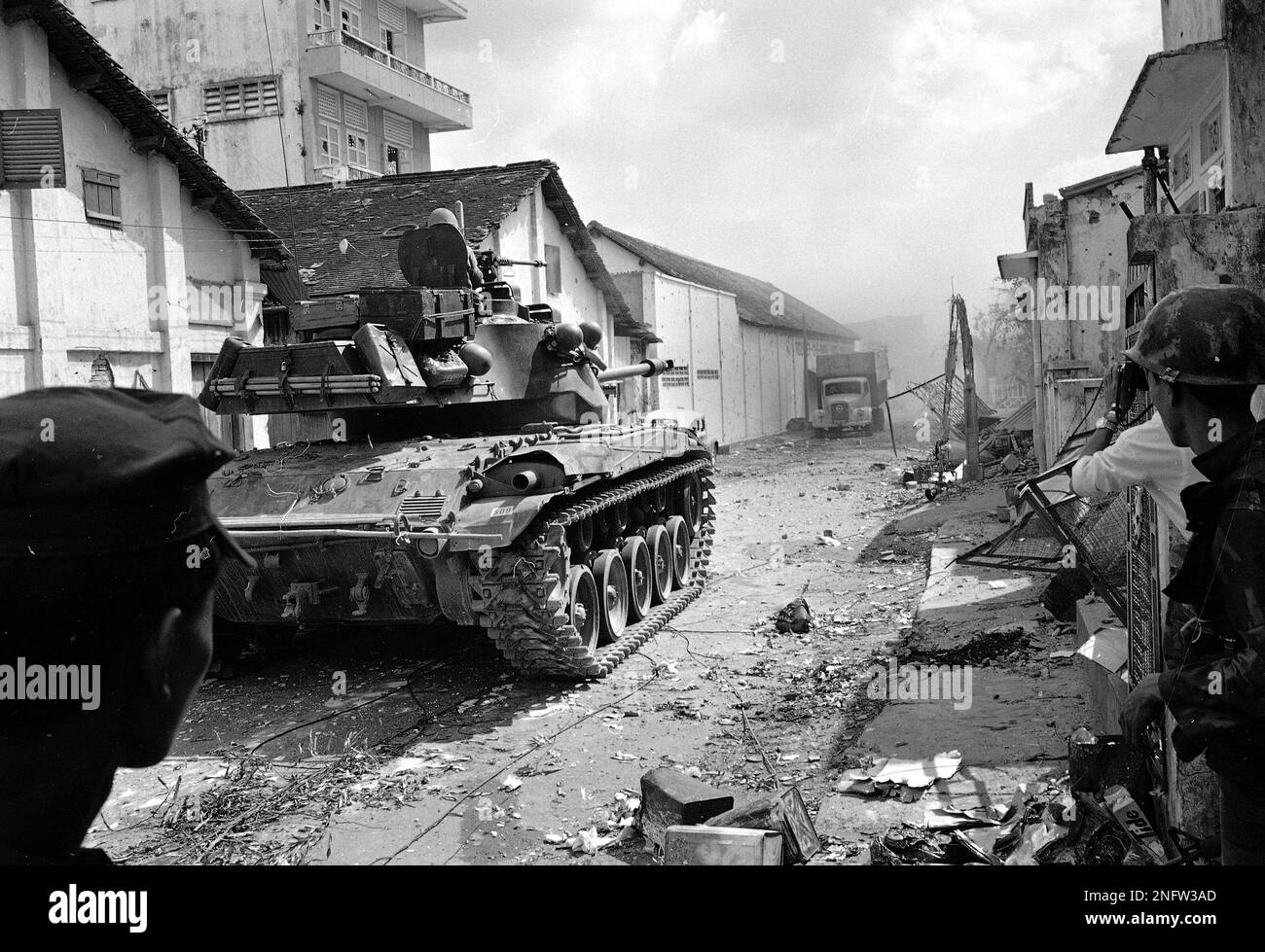 A South Vietnamese tank moves down an alley in the northeastern corner ...