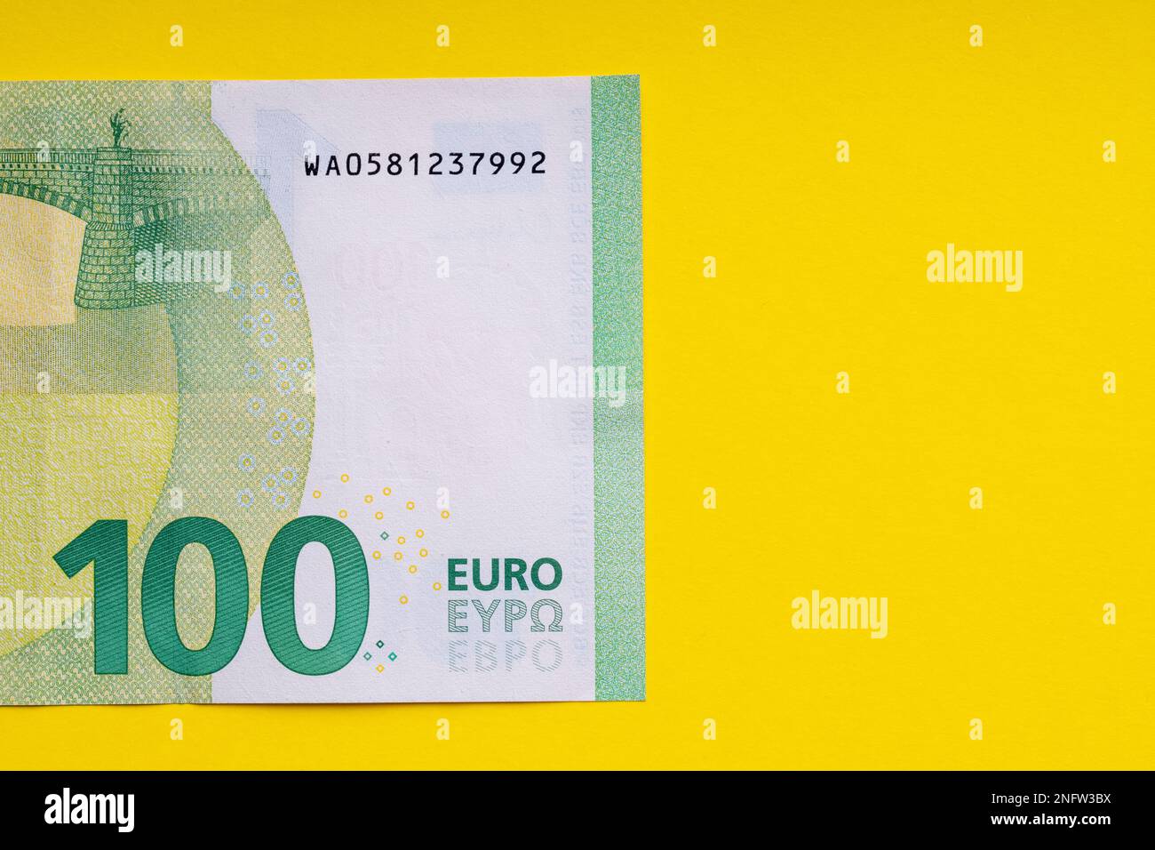 100 euro banknote close up, yellow background for business finance ...