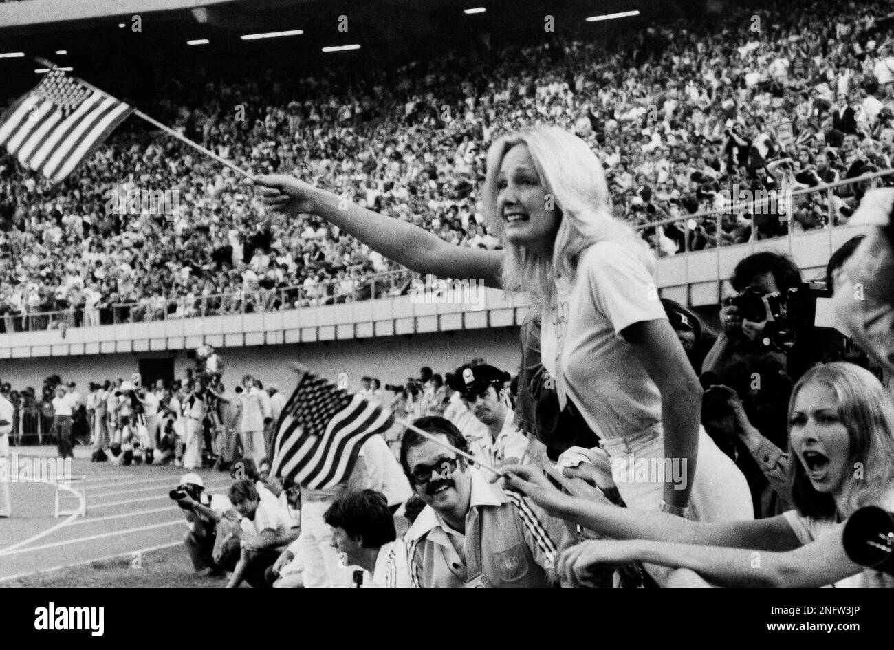 Bruce Jenner's biggest fans, Chrystie Jenner, waves the American flag ...