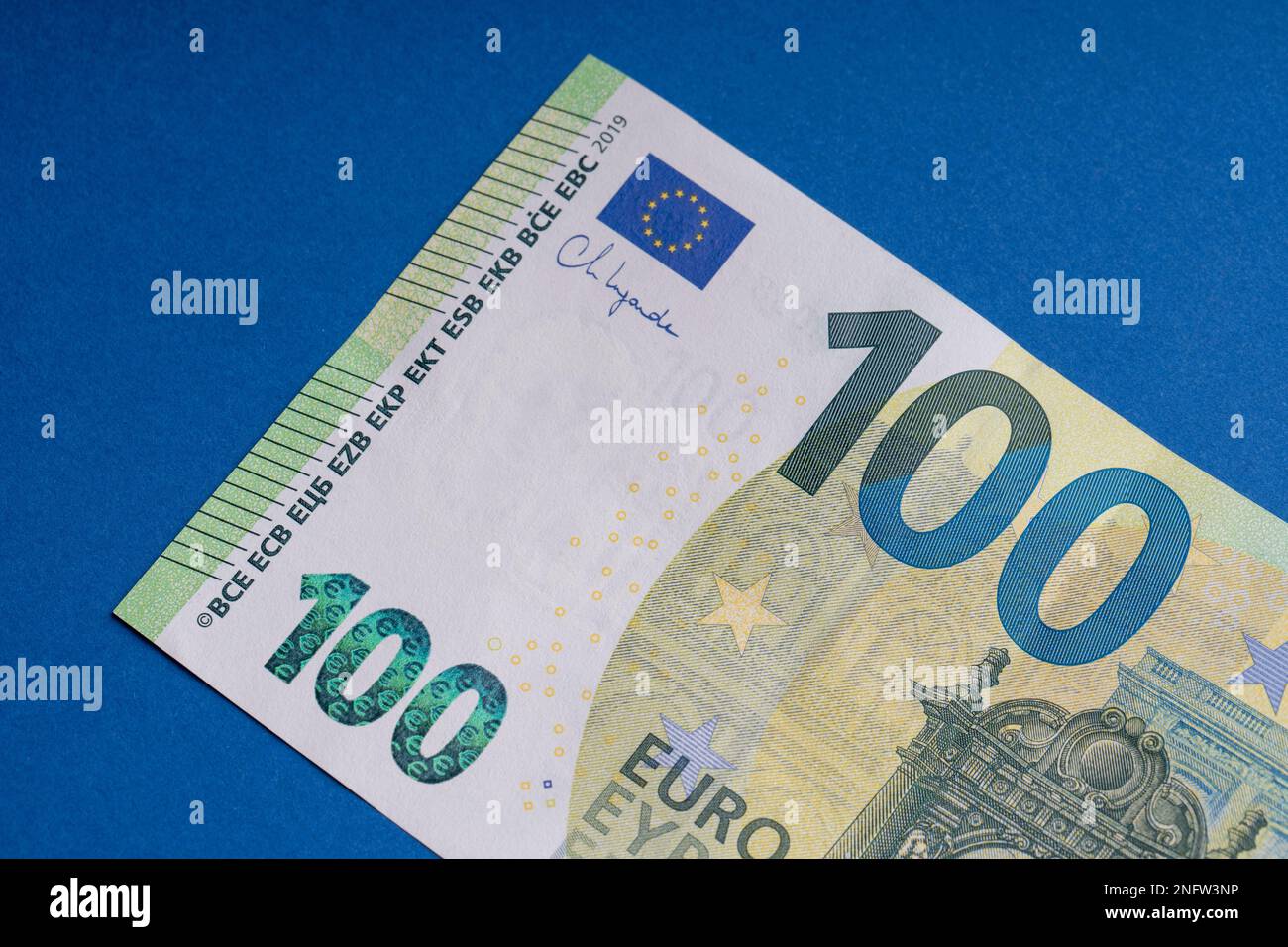 100 euro banknote close up, blue background for business finance topics ...