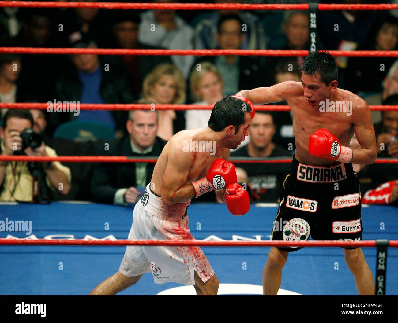 Cristian Mijares, of Mexico, right, punches Jose Navarro during their ...