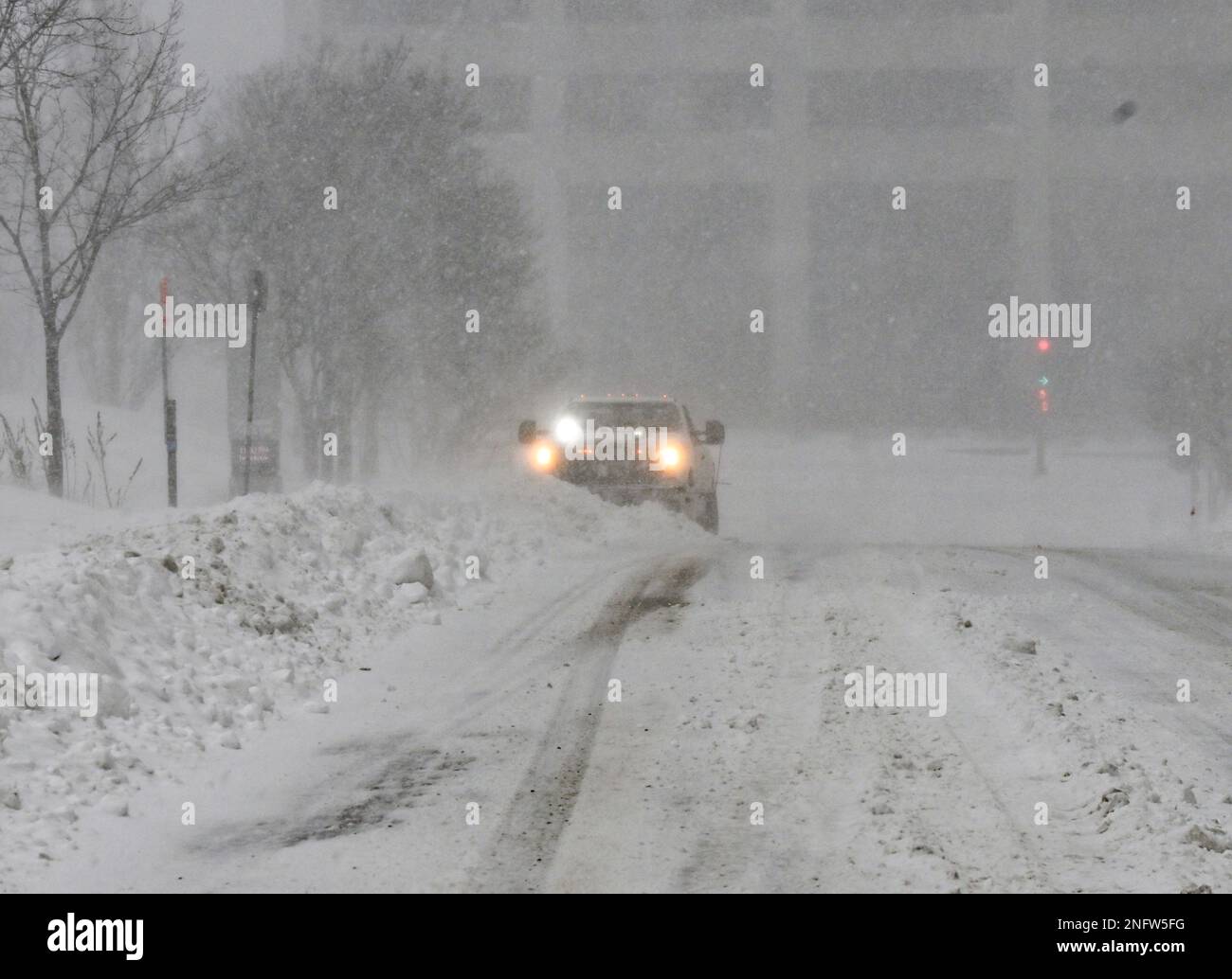 Canada. 17th Feb, 2023. A truck plows the side of a road during a ...
