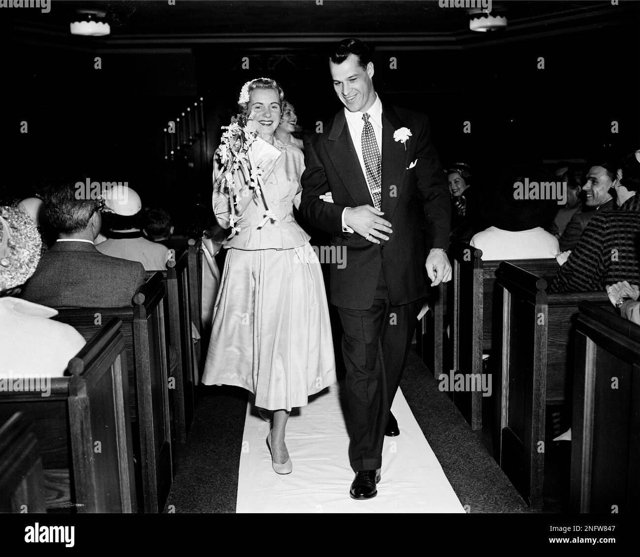 Detroit Red Wings' star Gordie Howe marches down the aisle with his new ...