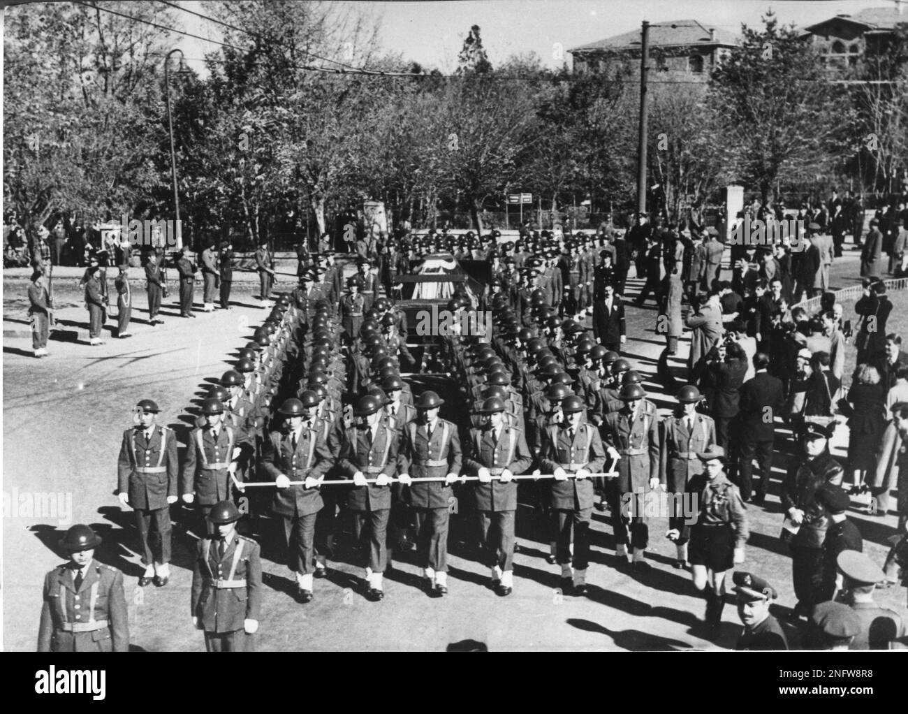 Turkish soldier walk in formation pulling the flag draped coffin of ...