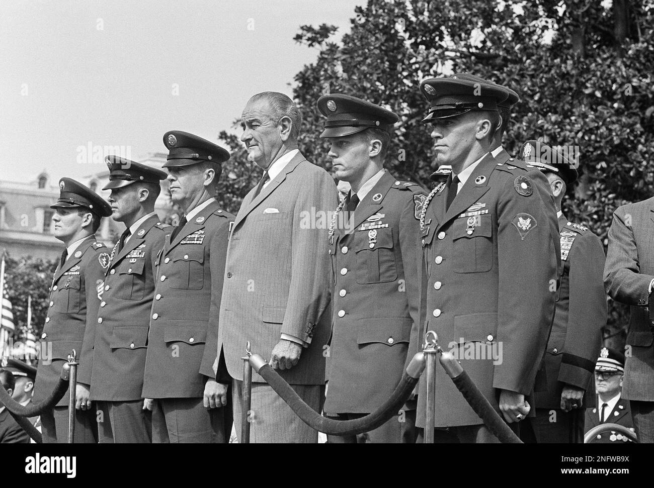 Five Army enlisted men pose with President Lyndon to receive the nation ...