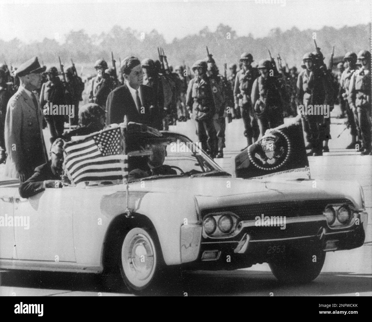 President John F. Kennedy stands in an open car Oct. 12, 1961, as he ...