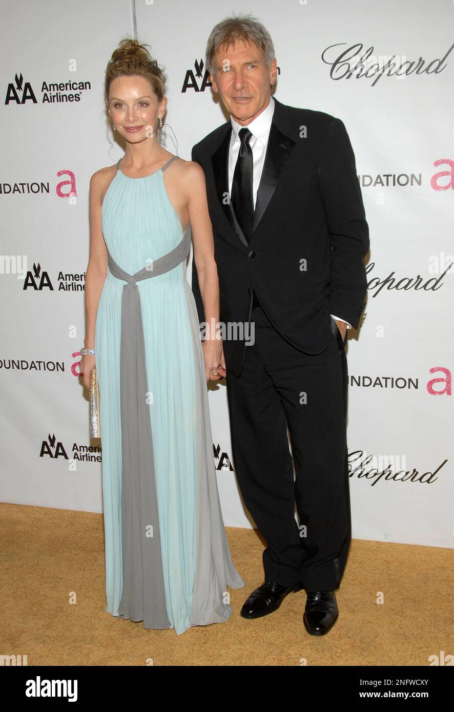 Actress Calista Flockhart, left, and actor Harrison Ford pose on the ...