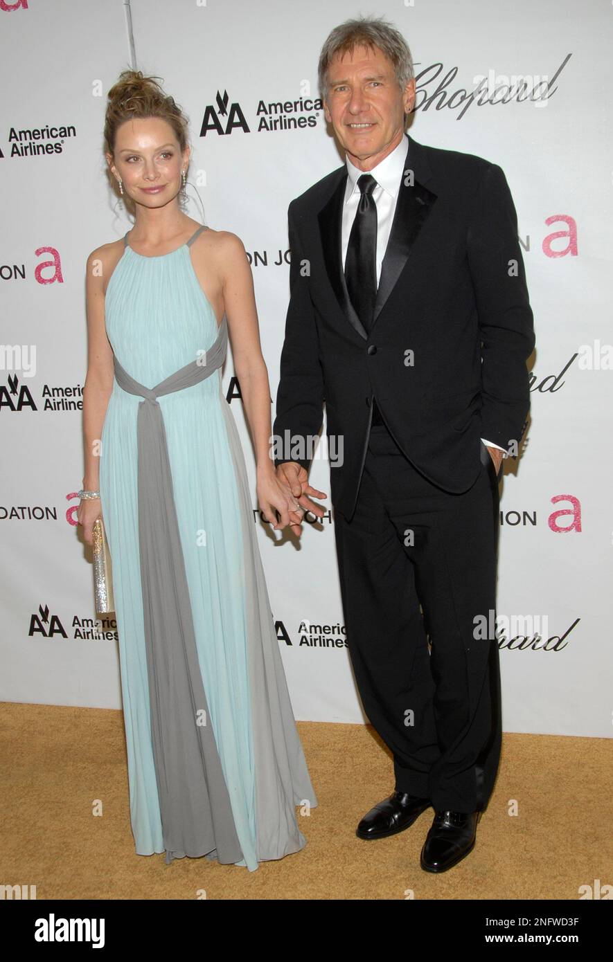 Actress Calista Flockhart, left, and actor Harrison Ford pose on the ...