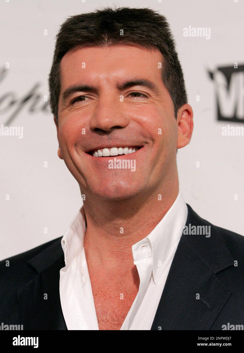 Simon Cowell poses on the press line at the Elton John Oscar Party in ...