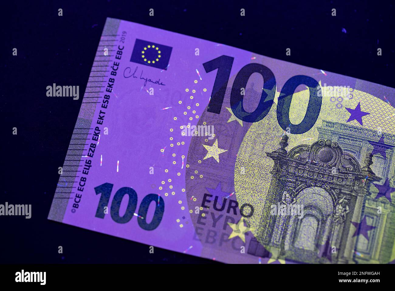 Euro currency in UV light protection. Euro in UV light to check the ...