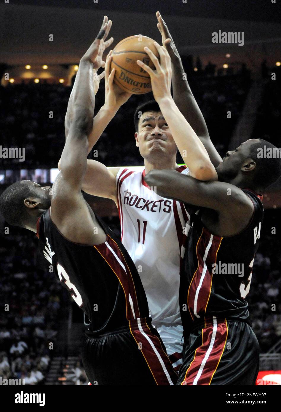 Houston Rockets' Yao Ming (11) of China is defended by Miami Heat's ...