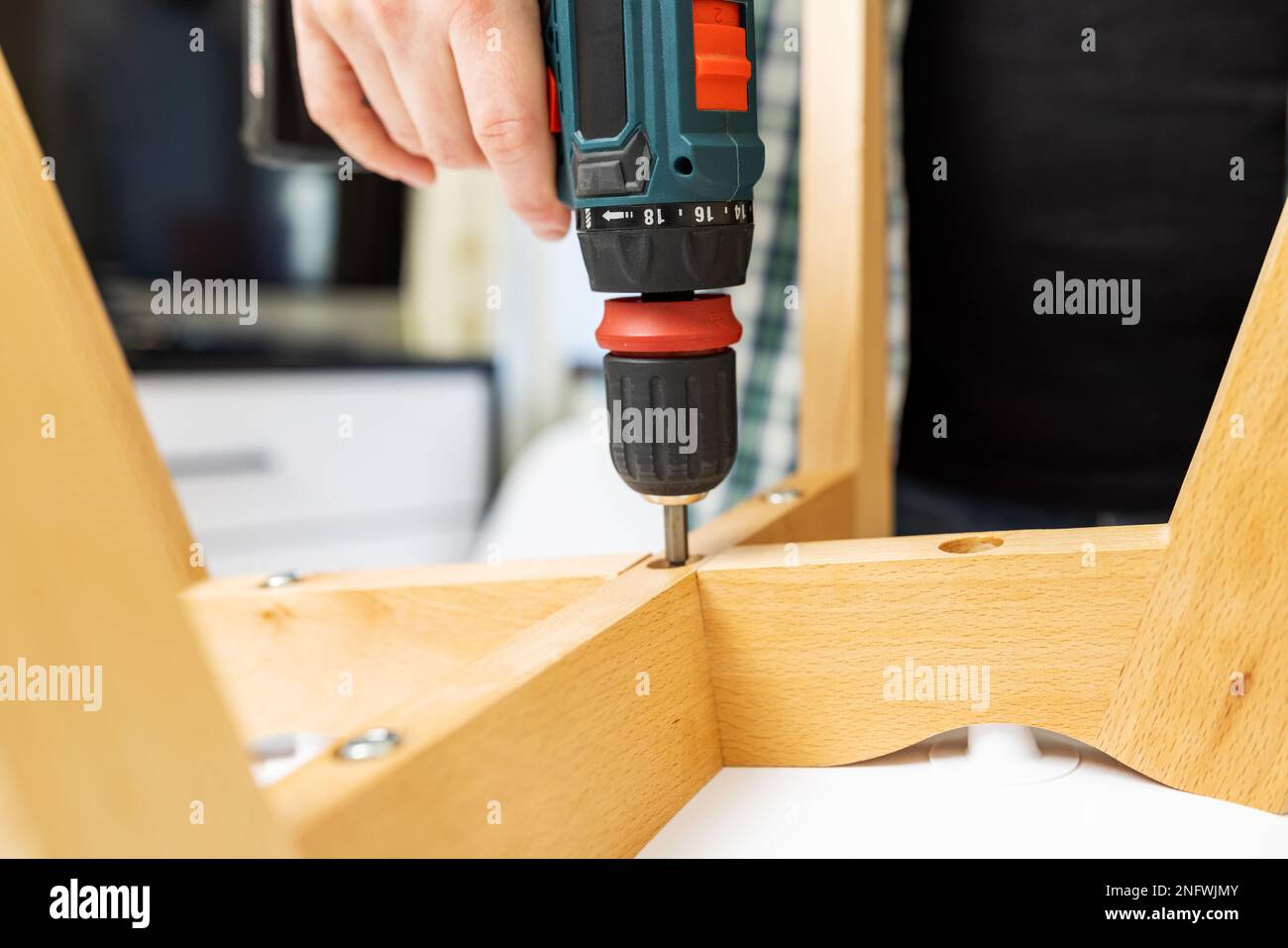 Assemble Furniture Man Assembling Chair Furniture Assembler With